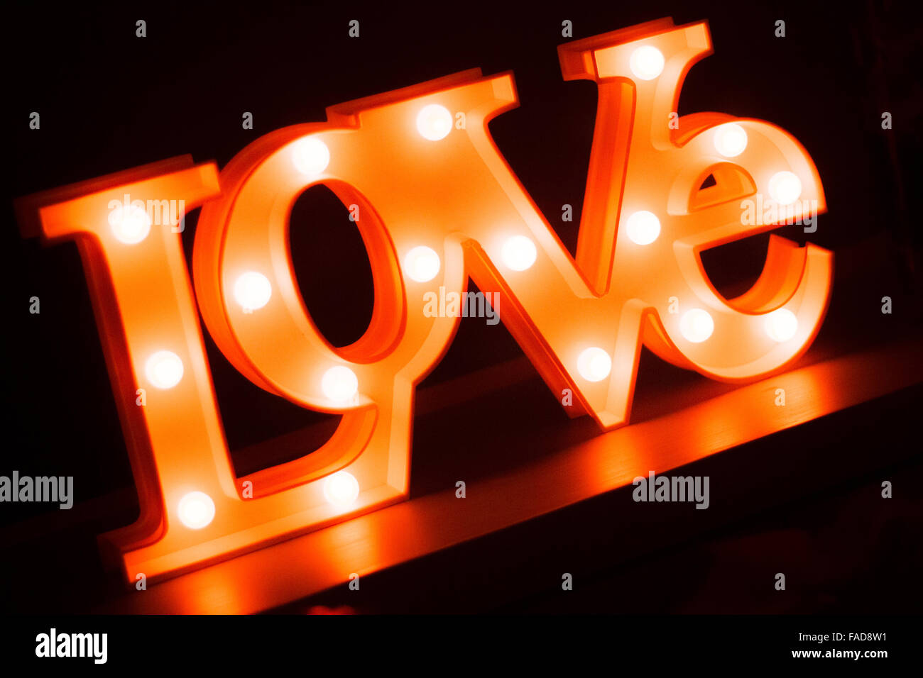 Romantic neon the word love sign at night Stock Photo - Alamy