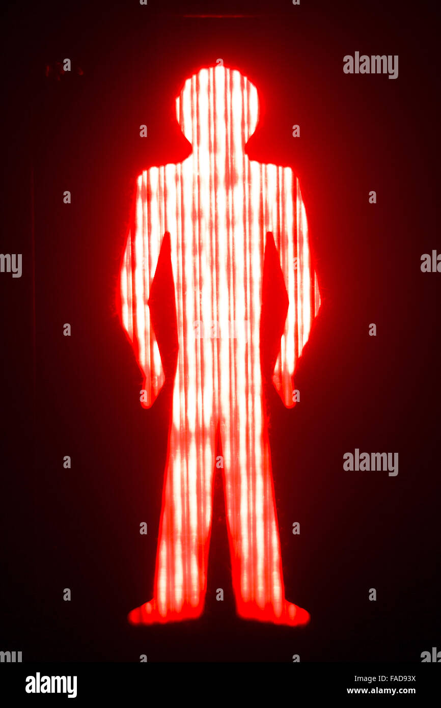 Green man go pedestrian traffic light sign Stock Photo - Alamy