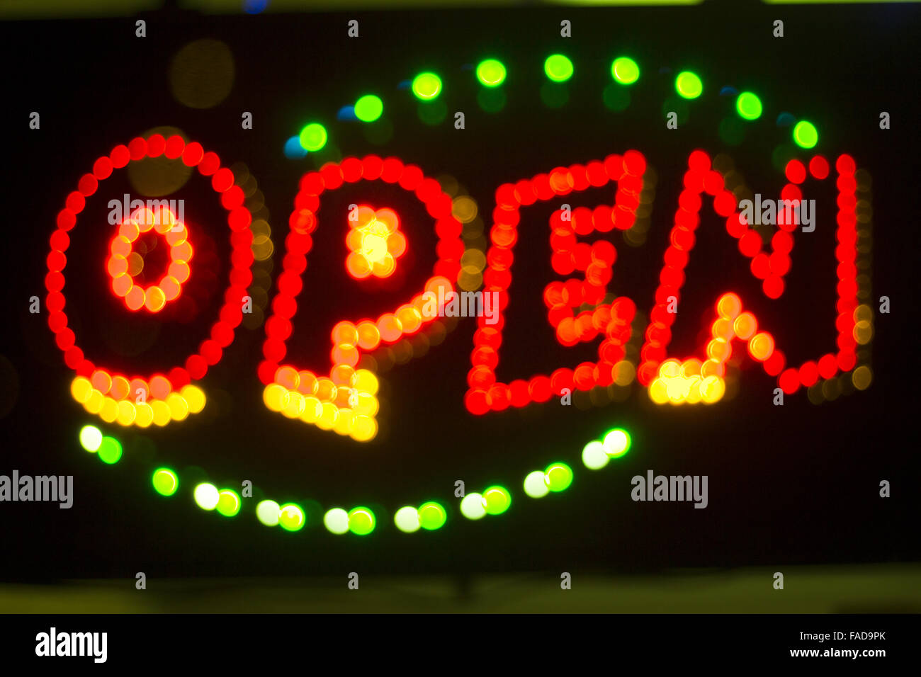 Neon shop open store sign at night in street photo Stock Photo - Alamy