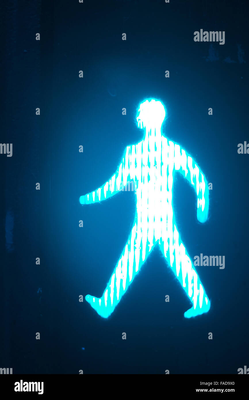 Green man go pedestrian traffic light sign Stock Photo - Alamy