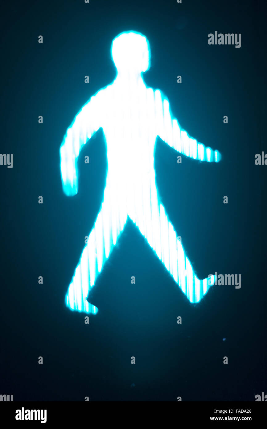 Green man go pedestrian traffic light sign Stock Photo - Alamy
