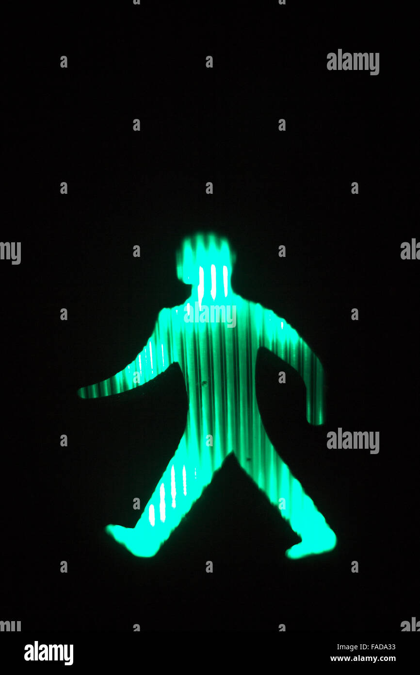 Green man go pedestrian traffic light sign Stock Photo - Alamy