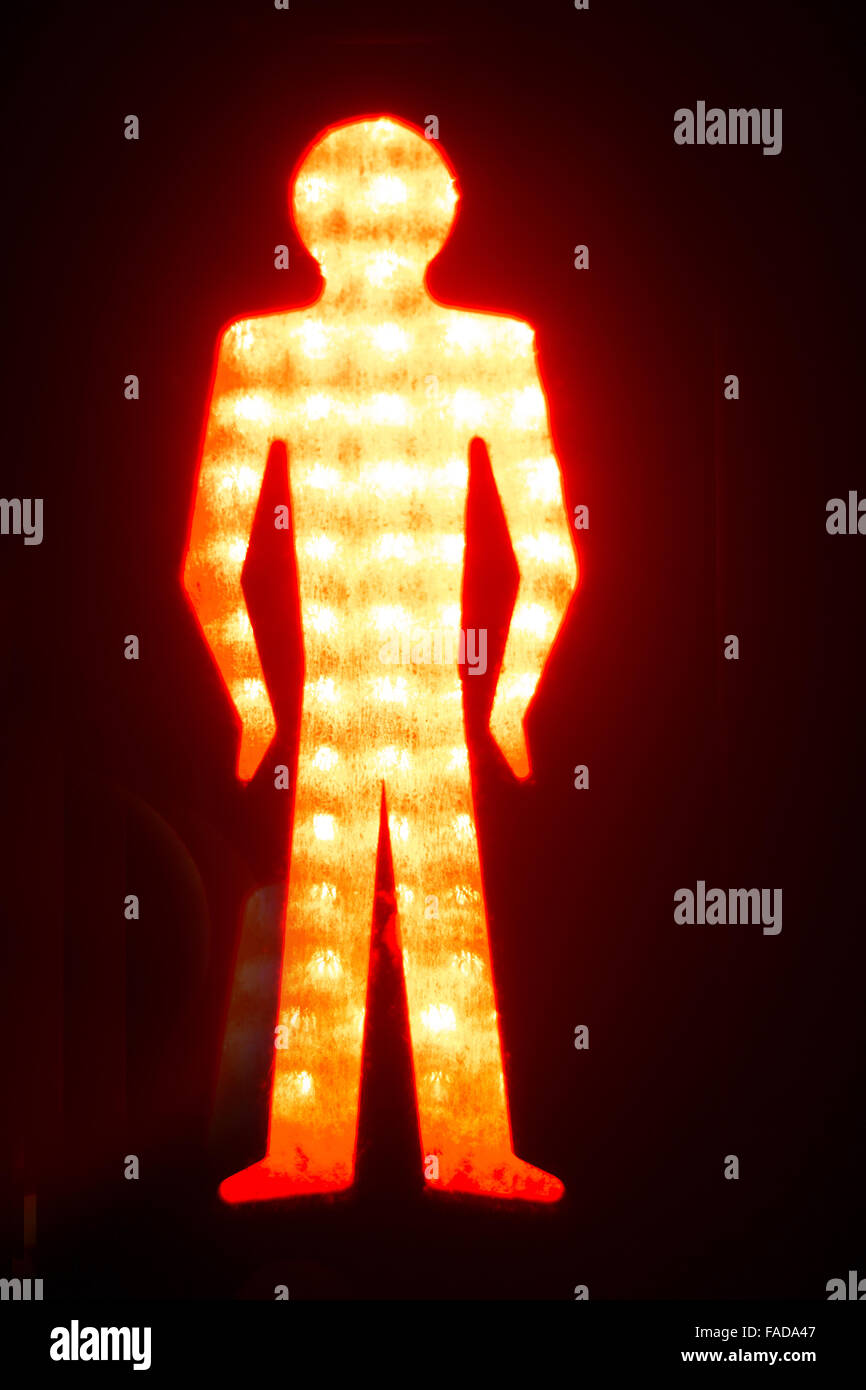 Green man go pedestrian traffic light sign Stock Photo - Alamy