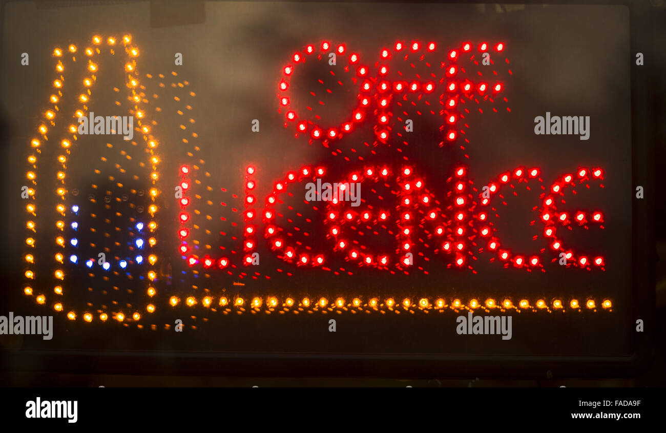 Off licence liquor store alcohol for sale neon light sign at night ...