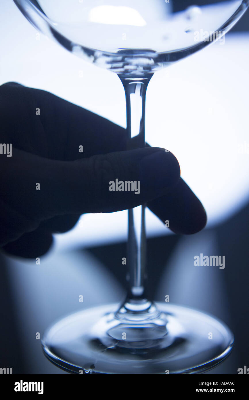 Wine glass in light at night photo Stock Photo - Alamy