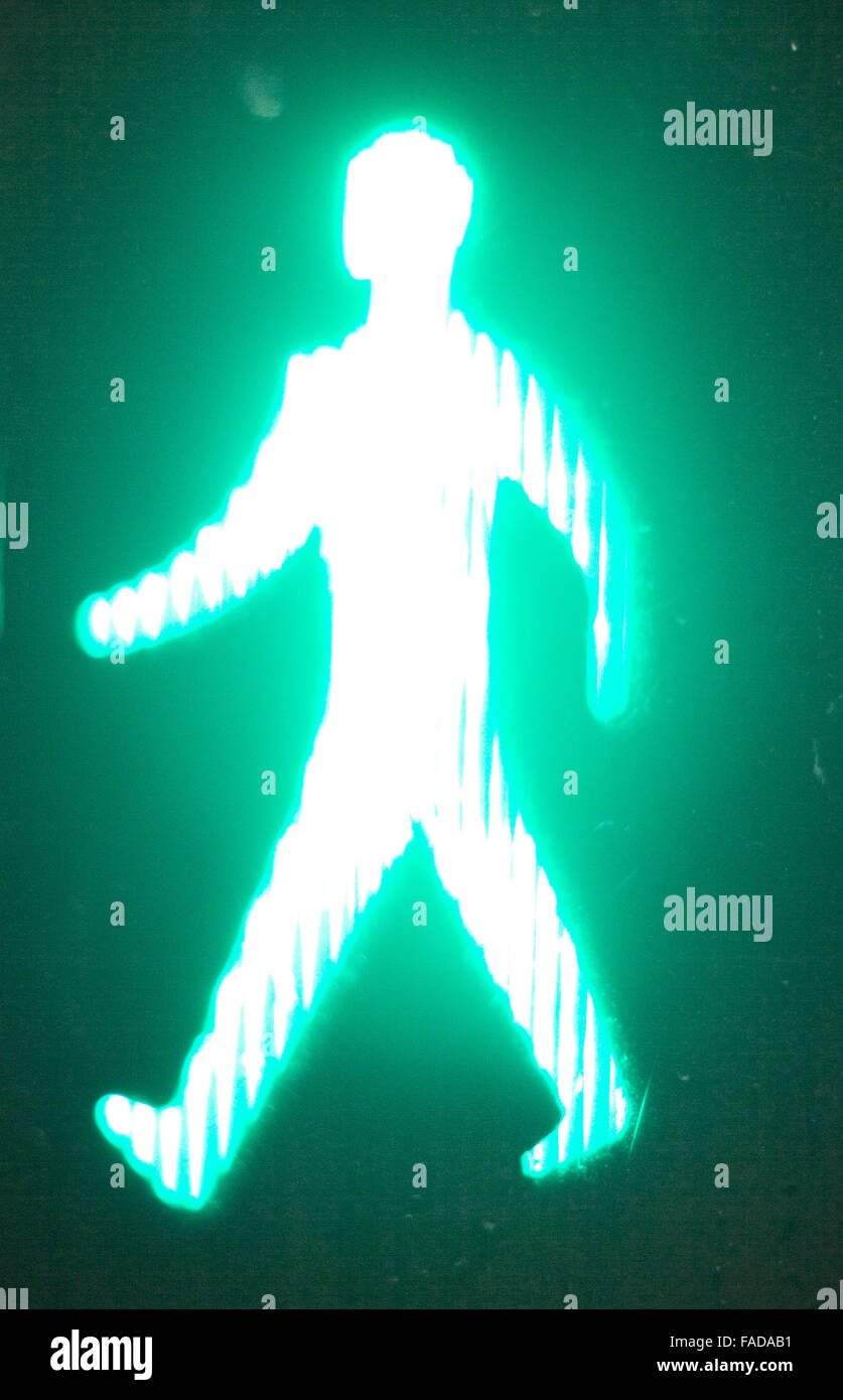 Green man go pedestrian traffic light sign Stock Photo - Alamy