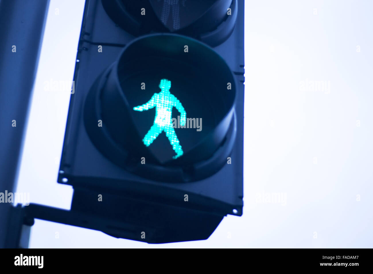 Green man go pedestrian traffic light sign Stock Photo - Alamy
