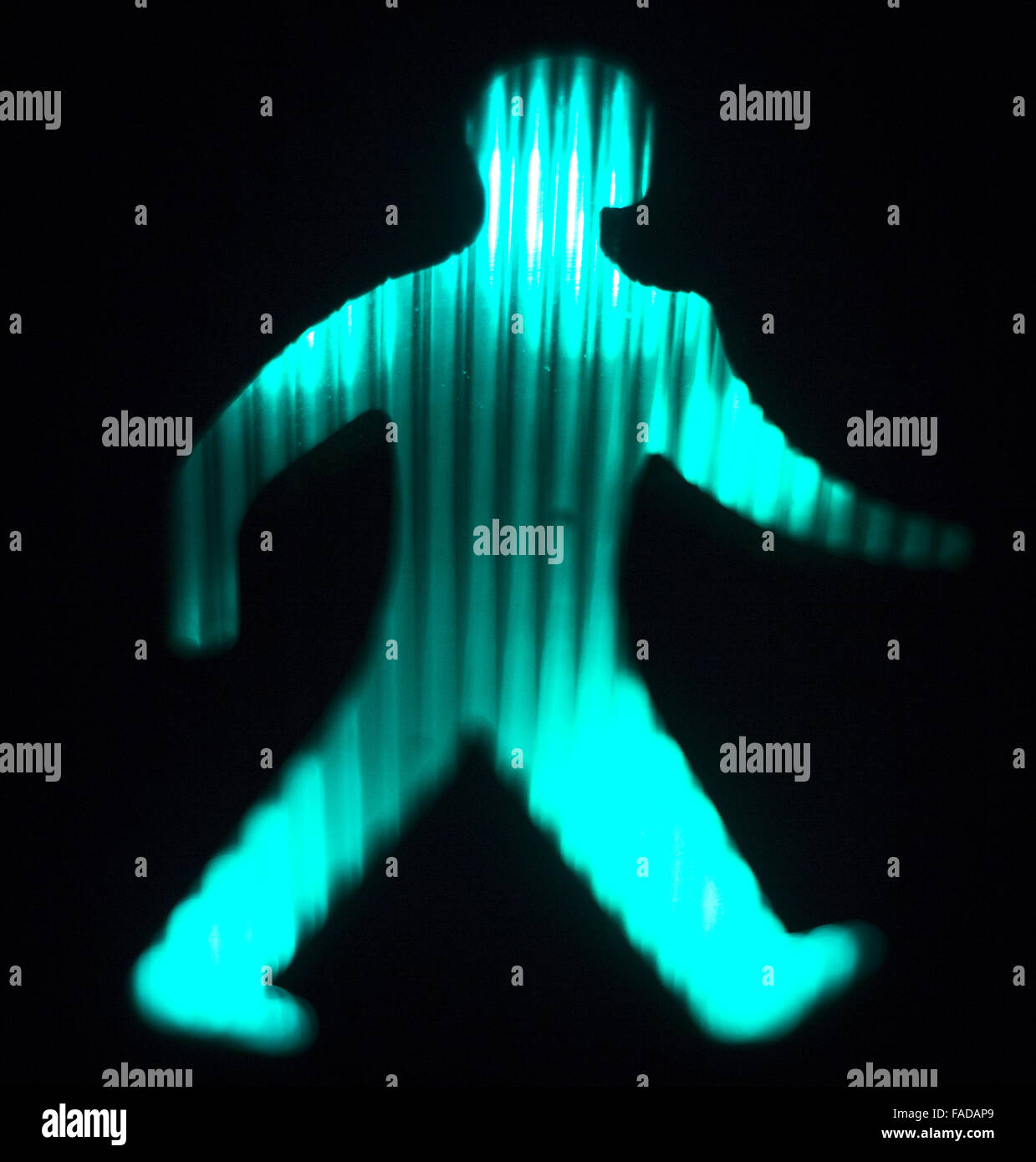 Green man go pedestrian traffic light sign Stock Photo - Alamy