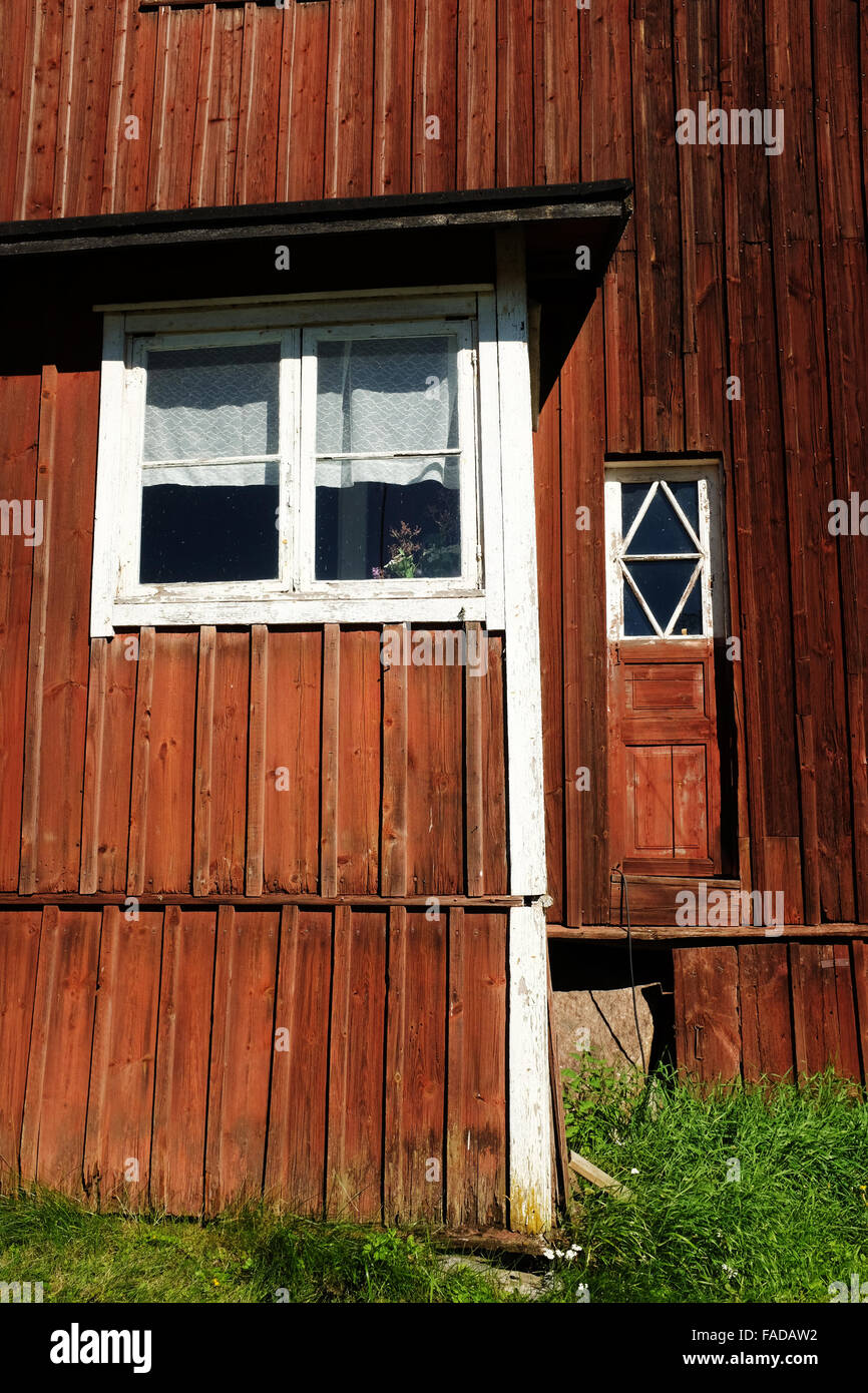 red wooden Finnish house, white window, green grass Stock Photo - Alamy