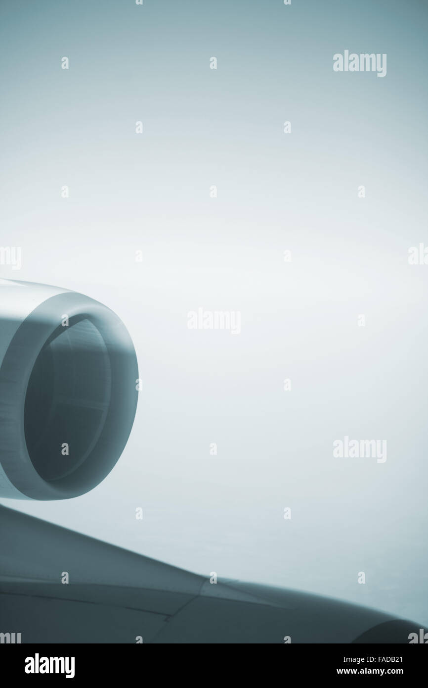 Airplane jet engine wing in flight and clouds in blue gray photo Stock ...