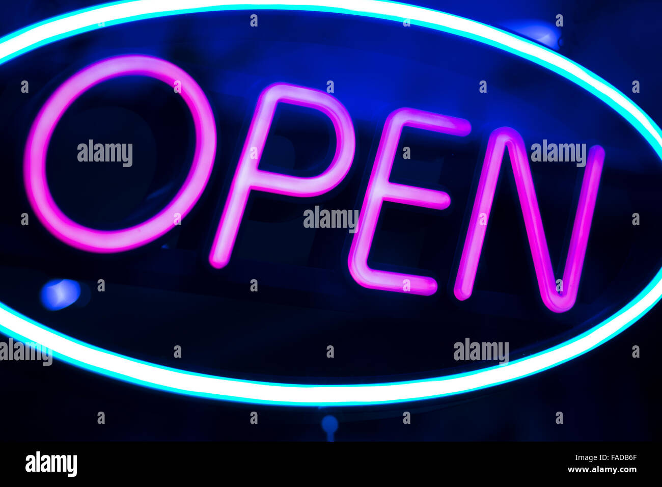 Neon shop open store sign at night in street photograph Stock Photo - Alamy