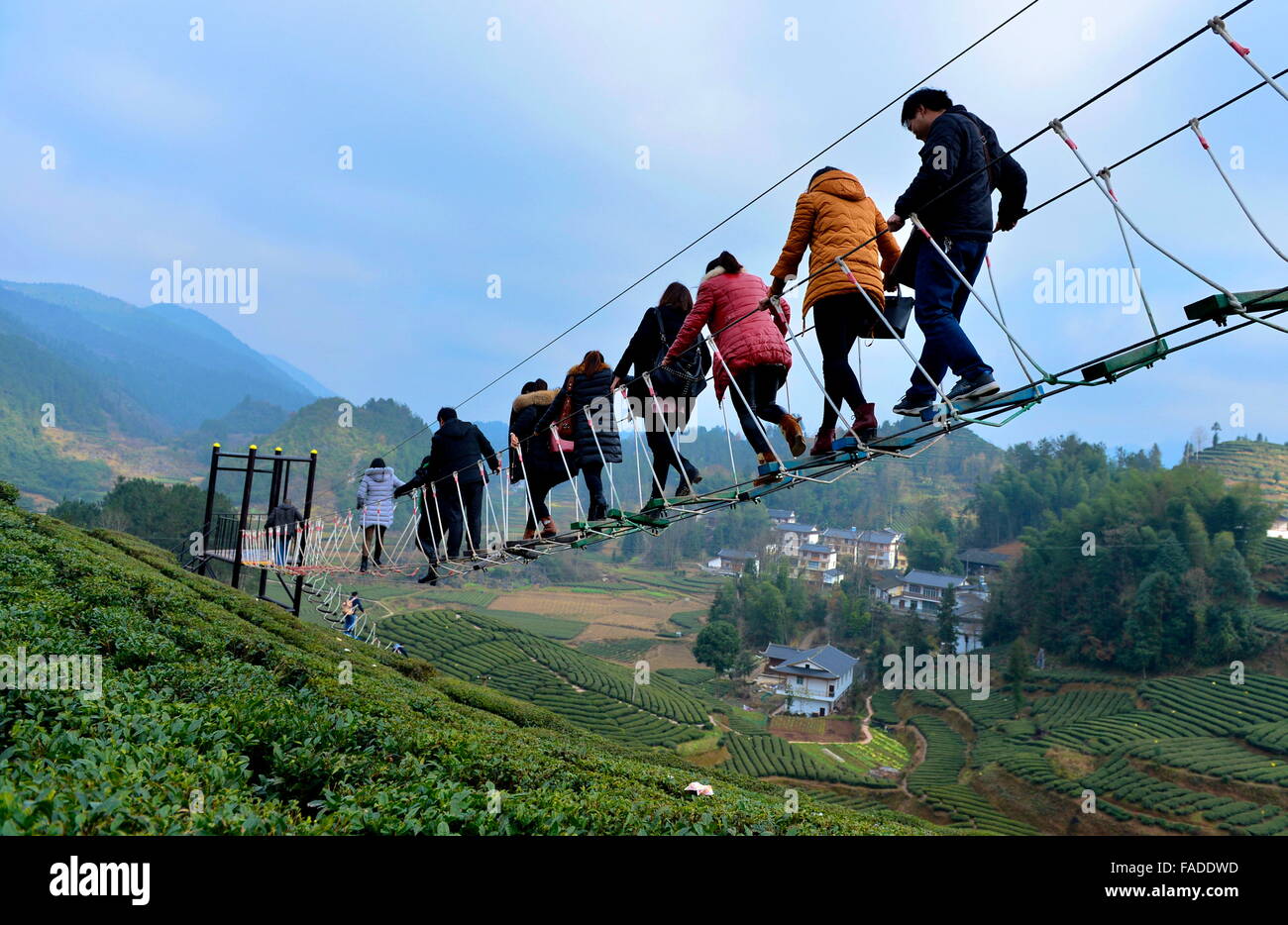 Enshi, China's Hubei Province. 27th Dec, 2015. People walk on the ...
