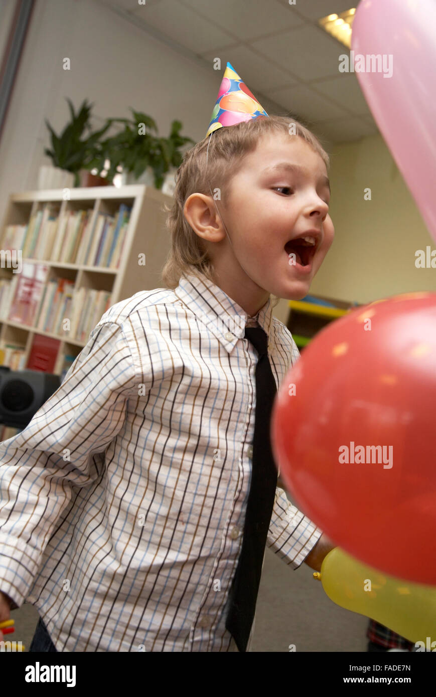 Little boy with a lot of baloons Stock Photo - Alamy