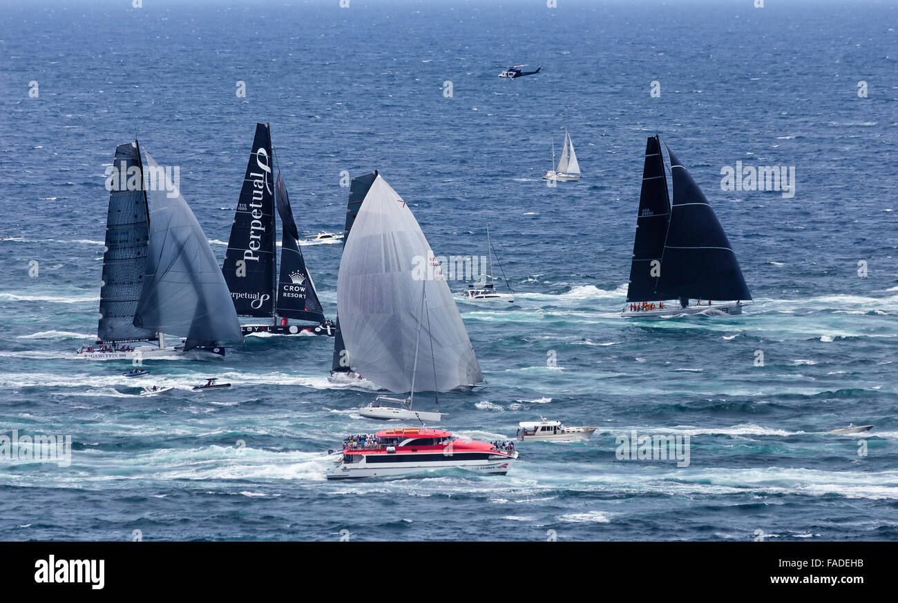 SYDNEY,AUSTRALIA - DECEMBER 26,2015: Motor boats follow yachts ...