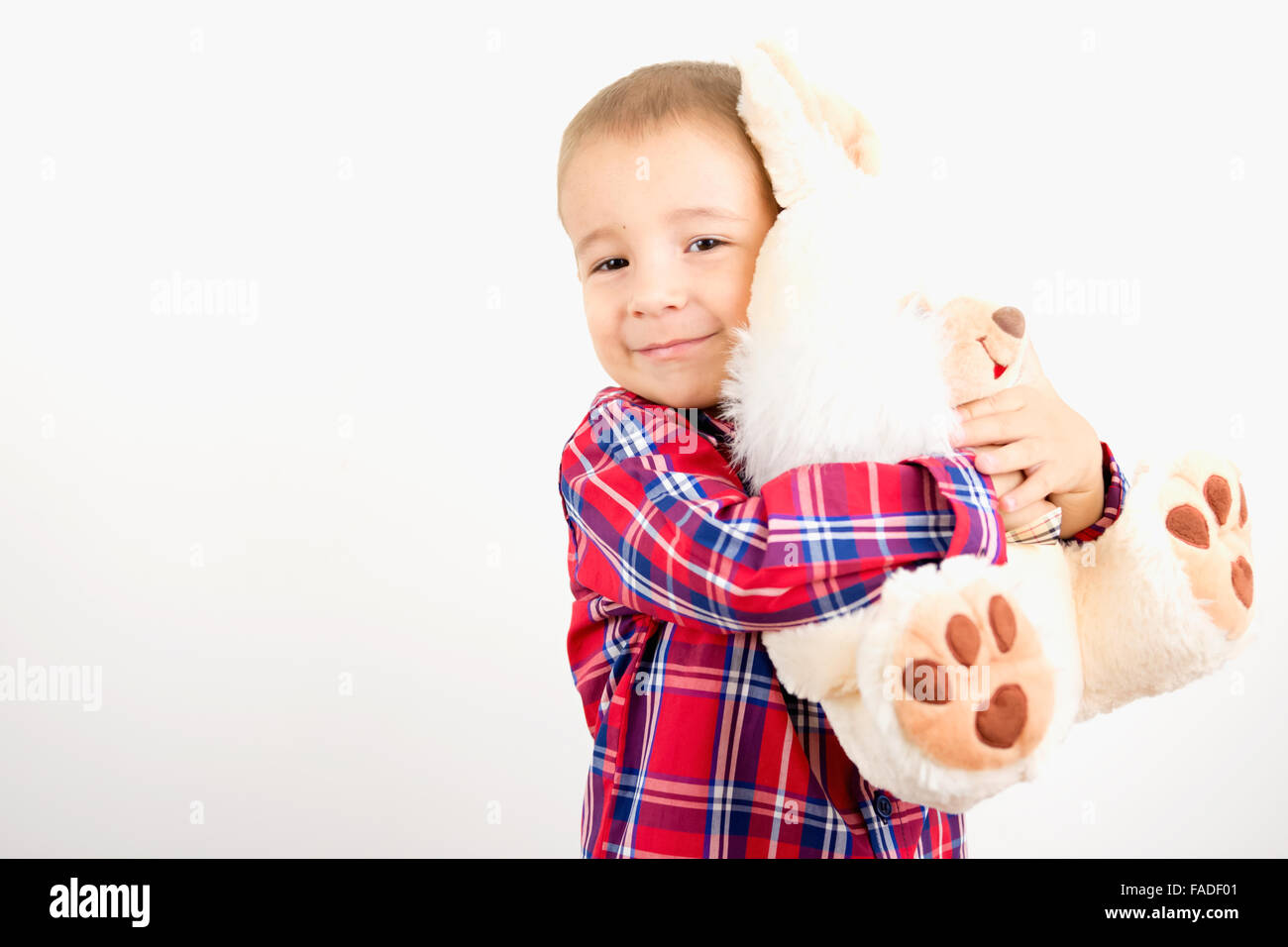 Portrait of a smiling little boy with a toy Stock Photo - Alamy
