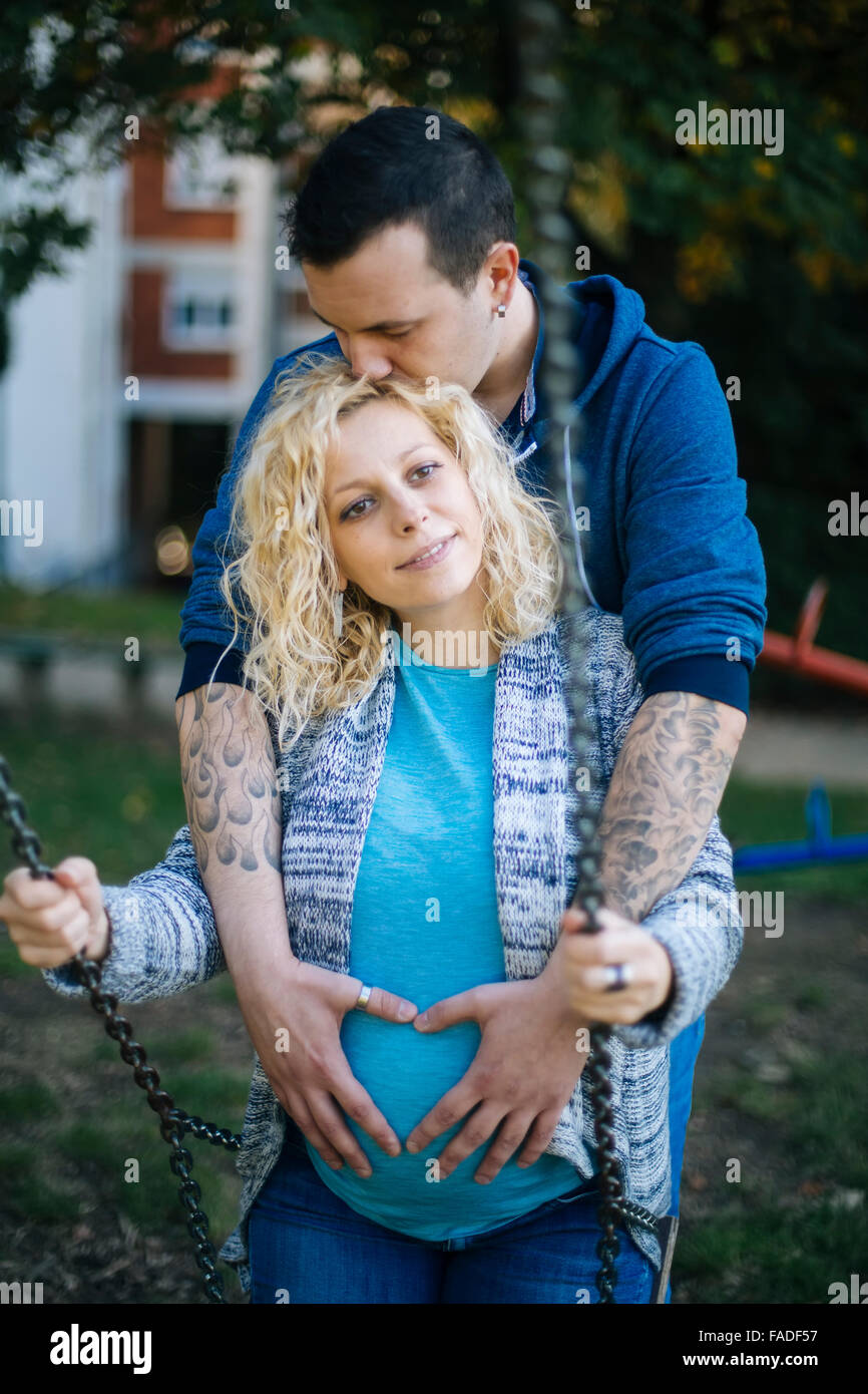 Young pregnant couple on the spring Stock Photo - Alamy