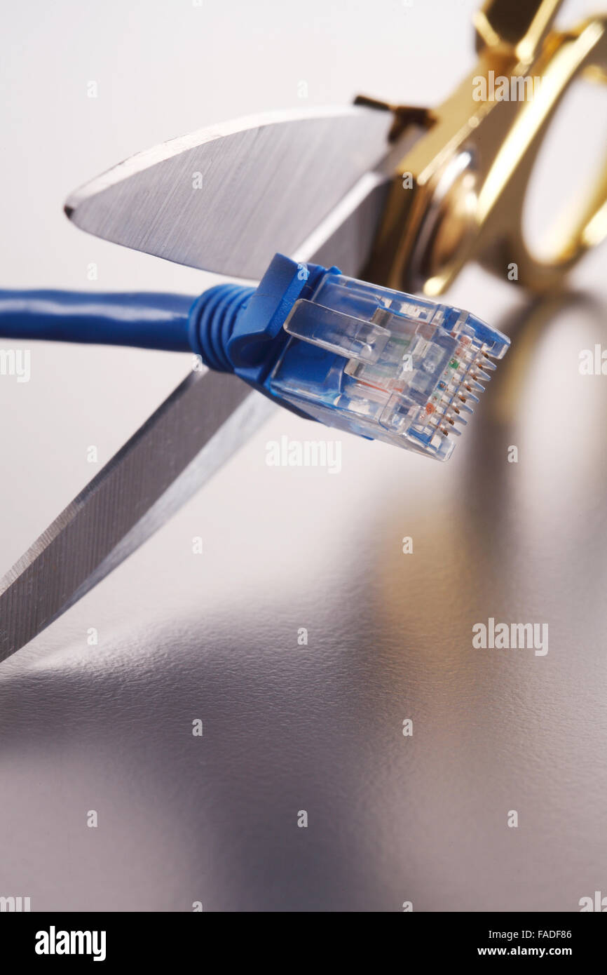 Scissors cutting network connection plug, close-up Stock Photo - Alamy