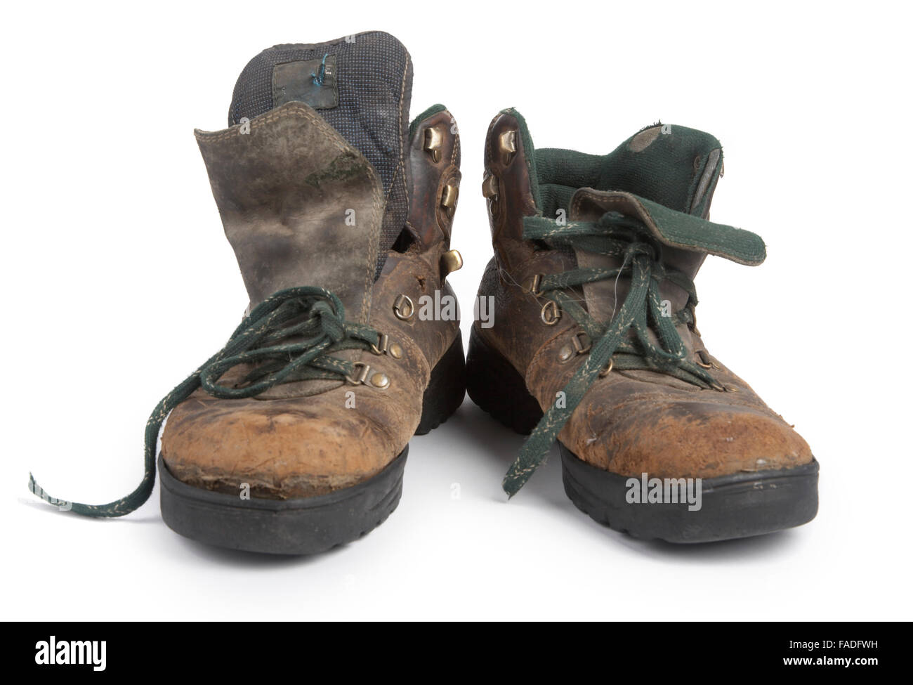 Old dirty boots on a white background Stock Photo - Alamy