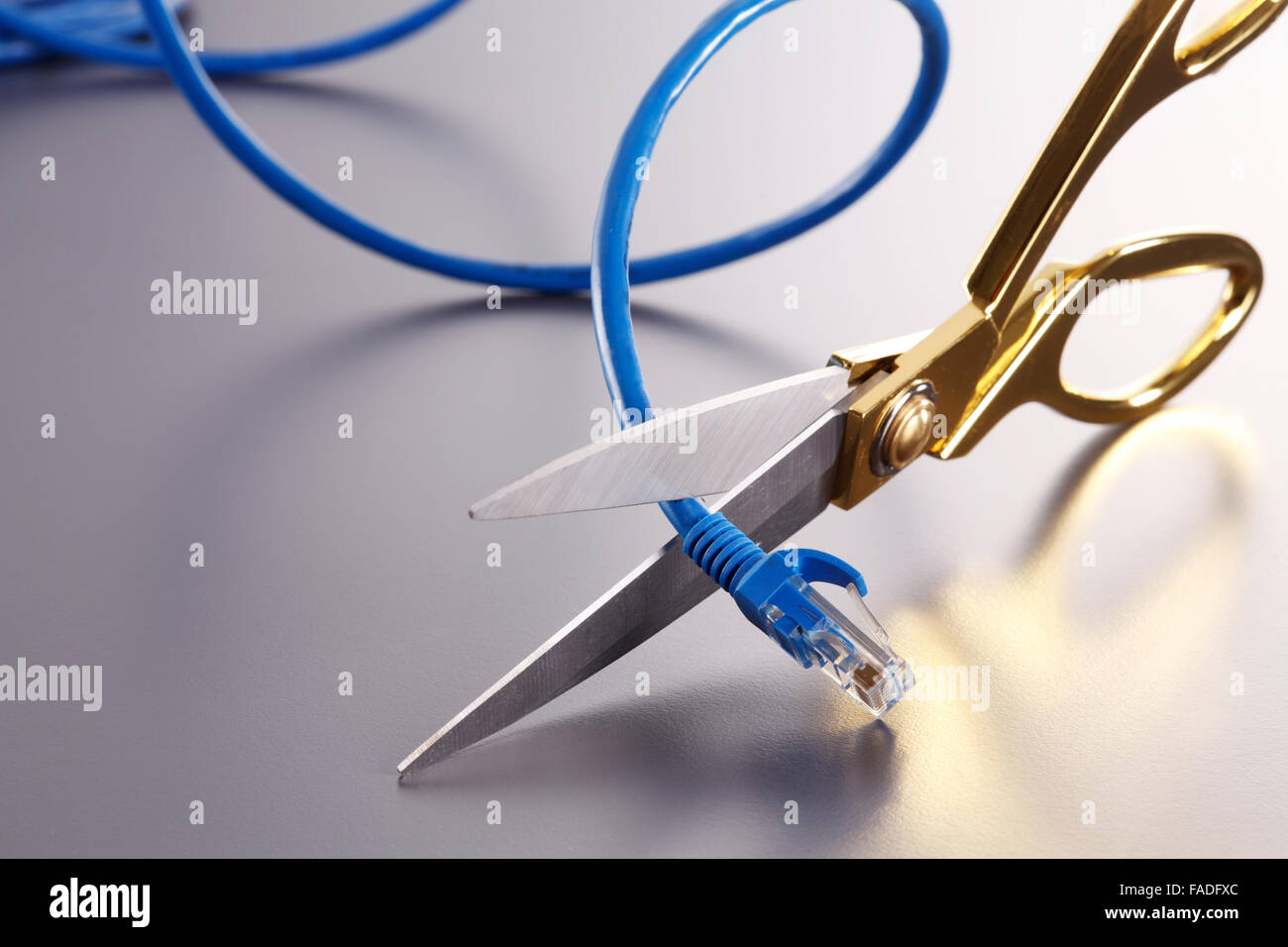 Scissors cutting network connection plug, close-up Stock Photo - Alamy