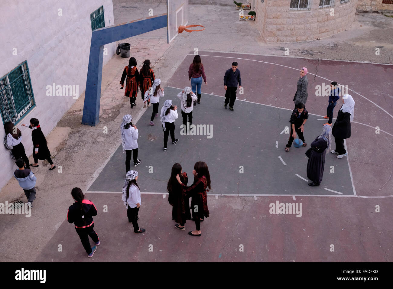 Palestinian schoolchildren playing in a playground in the Muslim ...