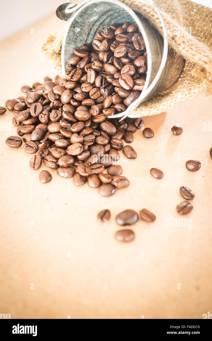 Coffee roasted bean in the bucket on wooden background, stock photo ...