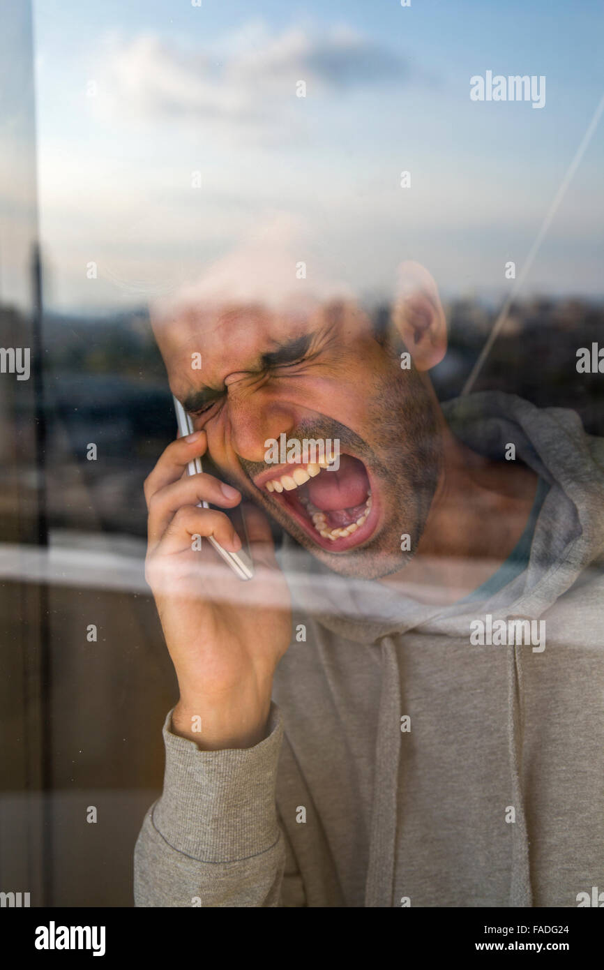 Man screaming at phone hi-res stock photography and images - Alamy
