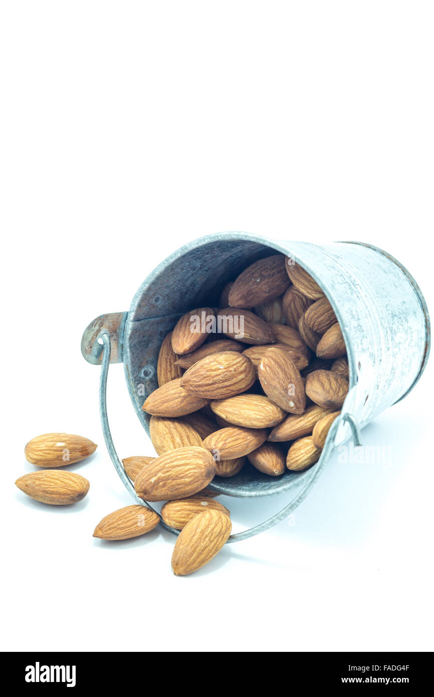 Almonds in bucket isolated on white background, stock photo Stock Photo ...