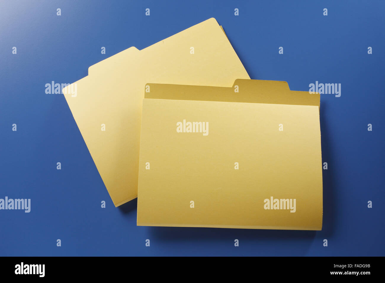 Blank File folder on the blue background Stock Photo - Alamy