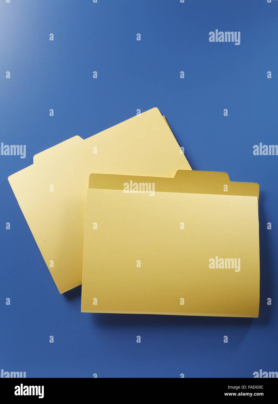 Blank File folder on the blue background Stock Photo - Alamy
