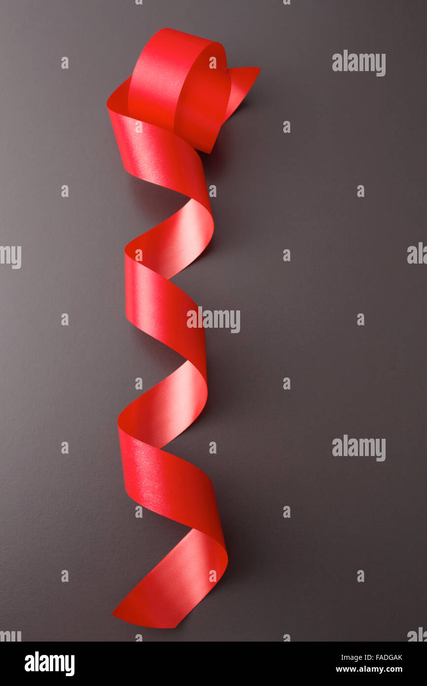 Close up of curled red ribbon Stock Photo - Alamy