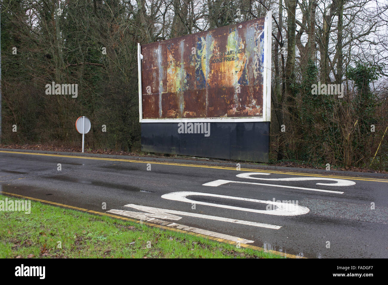Rusting billboard showing a faded advert landscape at the Reading ...