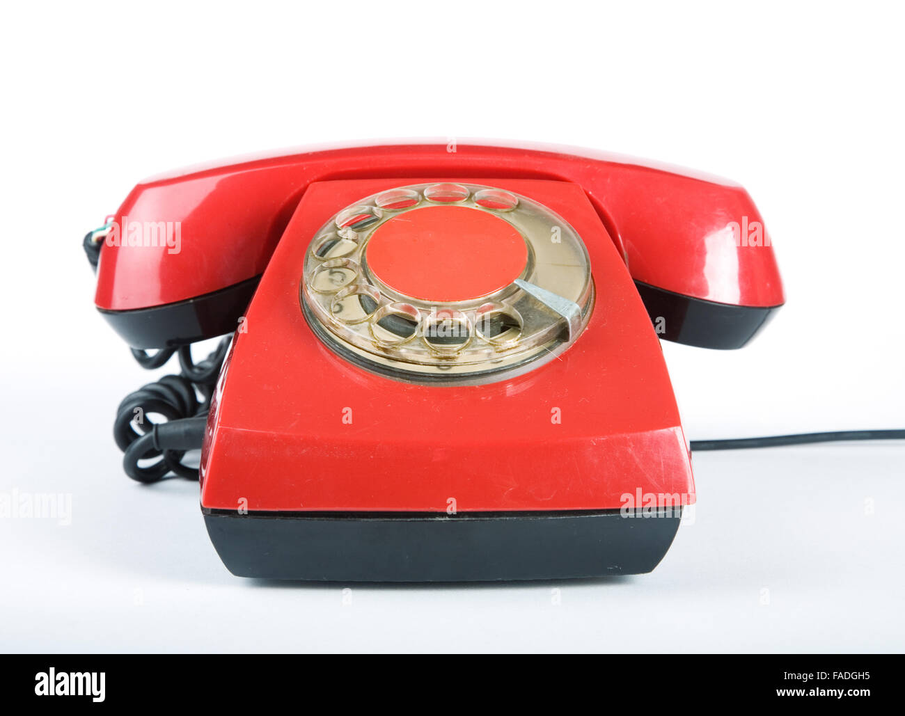 An old red phone on a white background Stock Photo - Alamy
