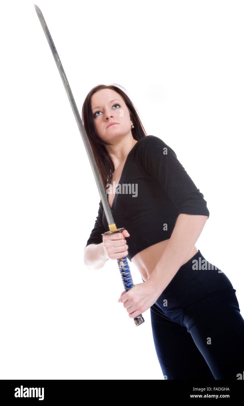 Beautiful woman in an aggressive posture with a sword on a white ...