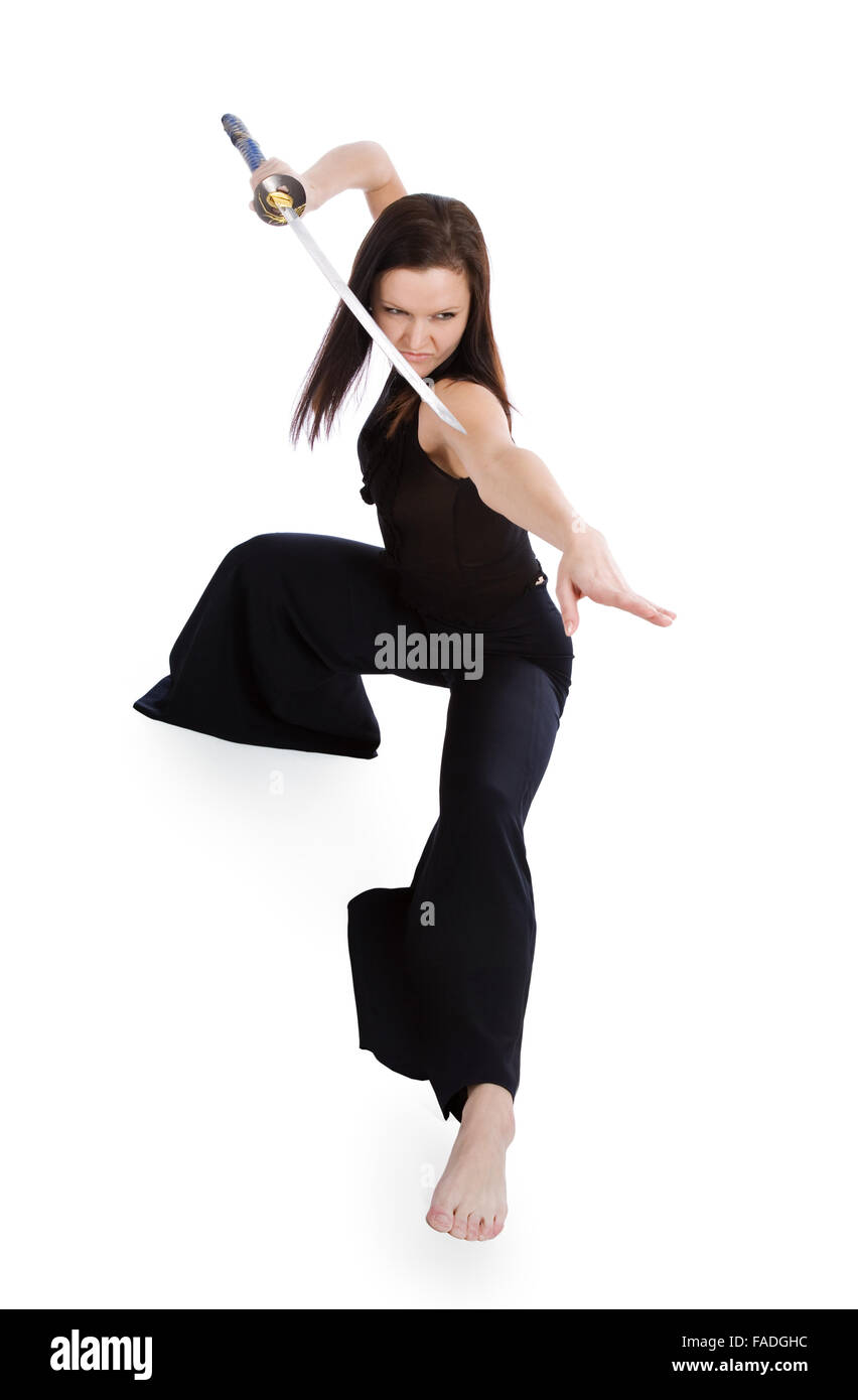 Beautiful woman in an aggressive posture with a sword on a white ...