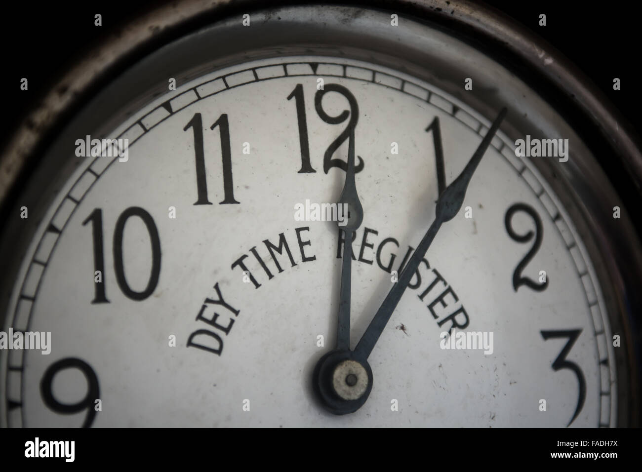 Five minutes past twelve on a Vintage Clock Stock Photo - Alamy