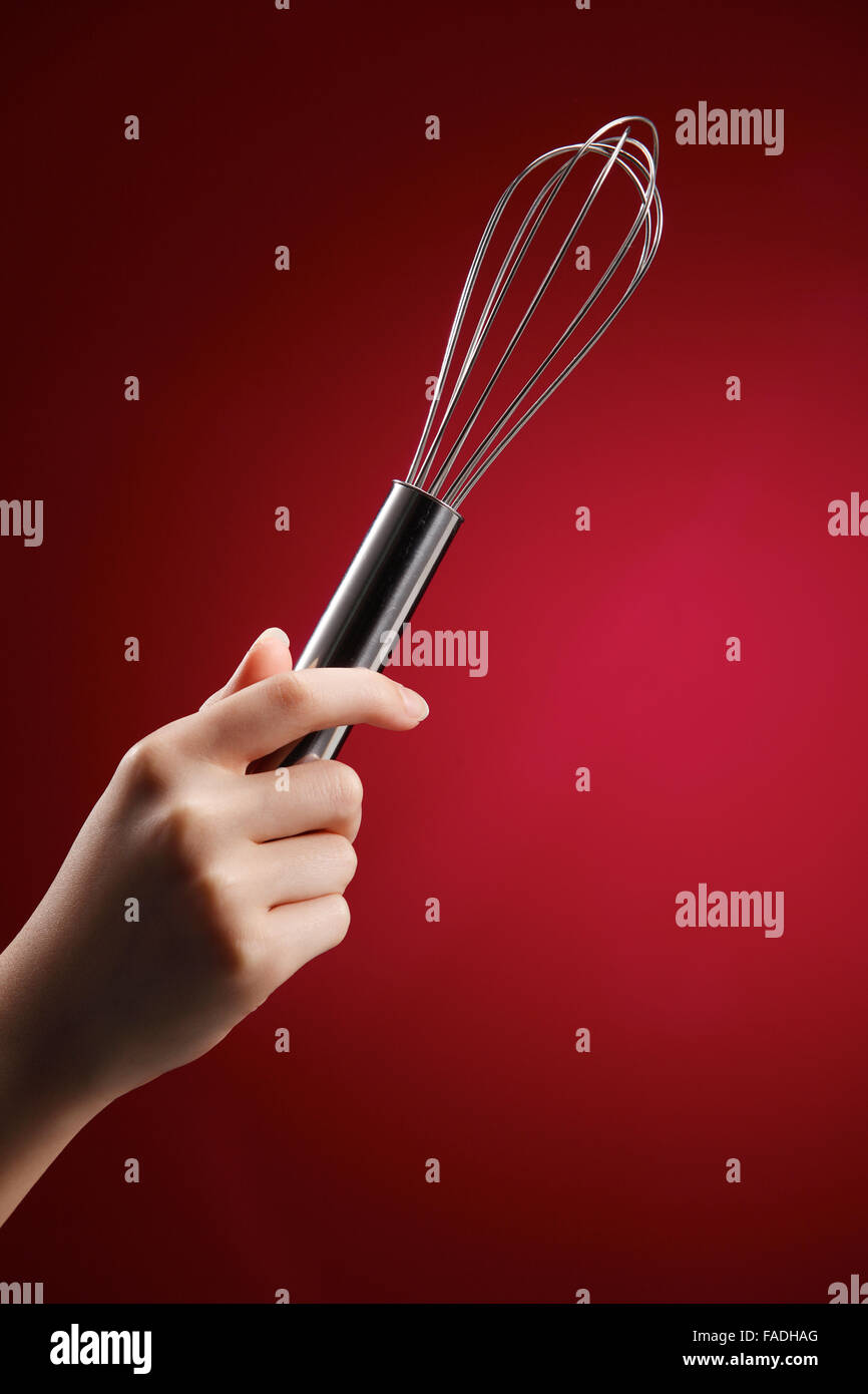 child holding a wire whisk Stock Photo - Alamy