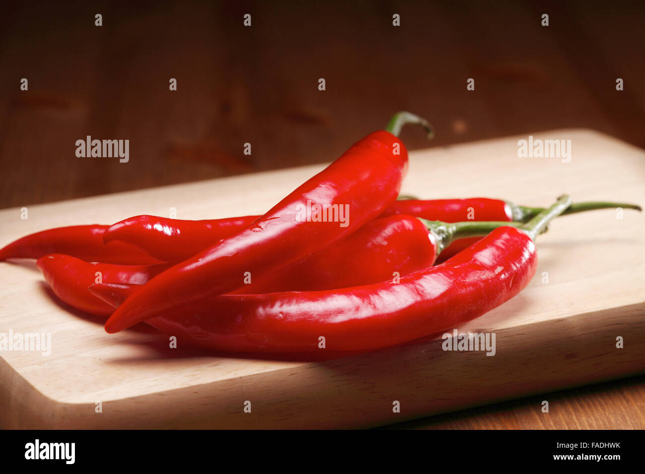 Red chilli on the chopping board Stock Photo - Alamy