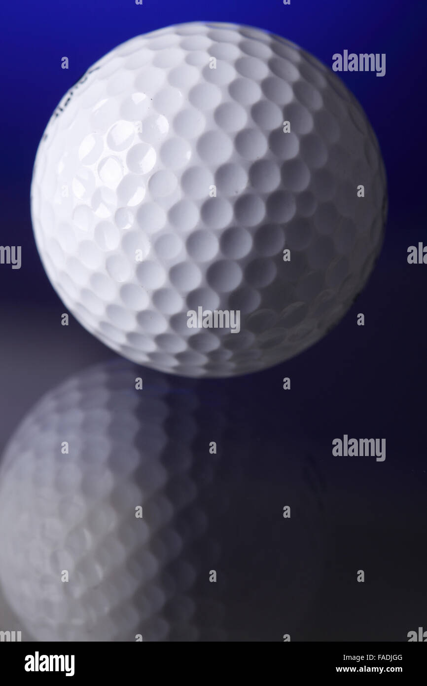 Golf Ball on blue Background Stock Photo - Alamy