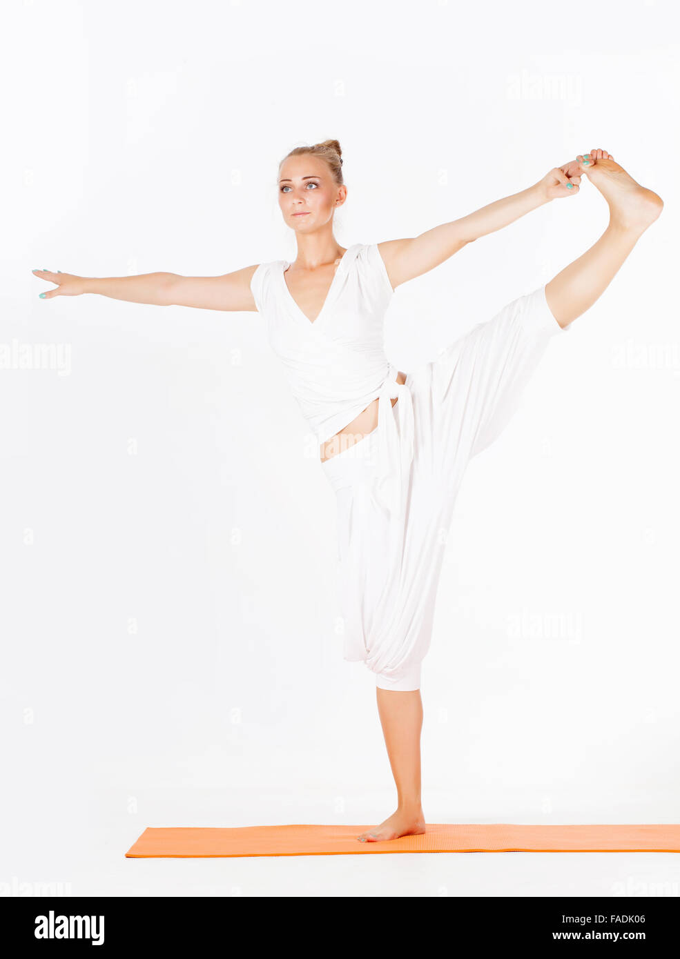 Woman making yoga figure Stock Photo - Alamy