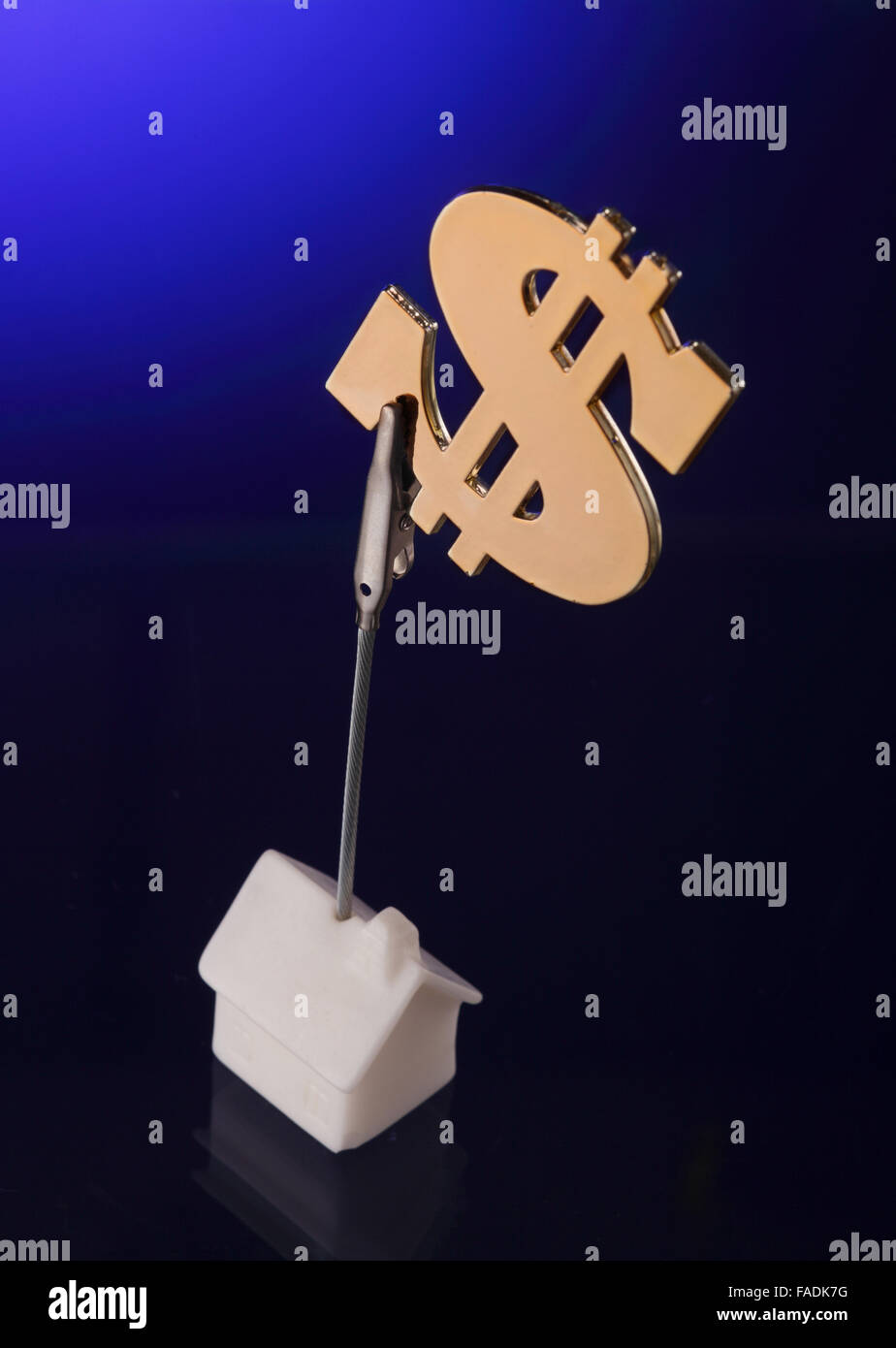 Dollar sign and model home Stock Photo - Alamy