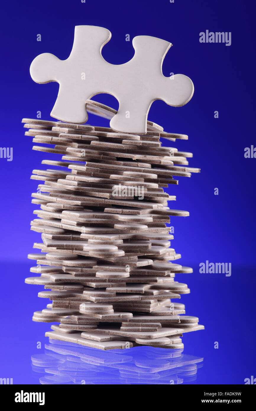 Stack of jigsaw puzzle pieces Stock Photo - Alamy