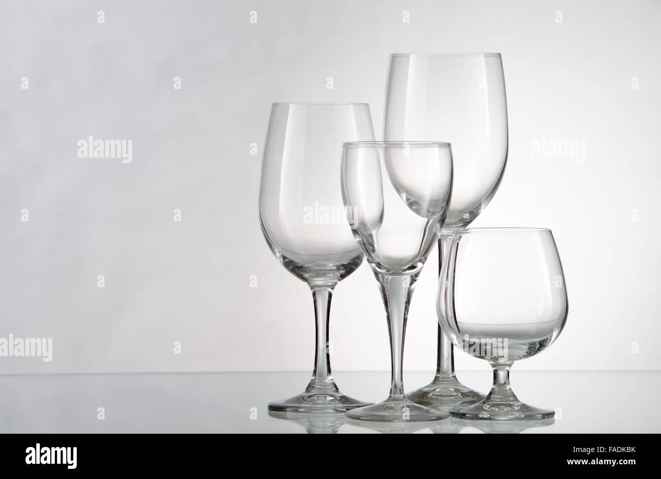 Glassware against black and white background Stock Photo - Alamy