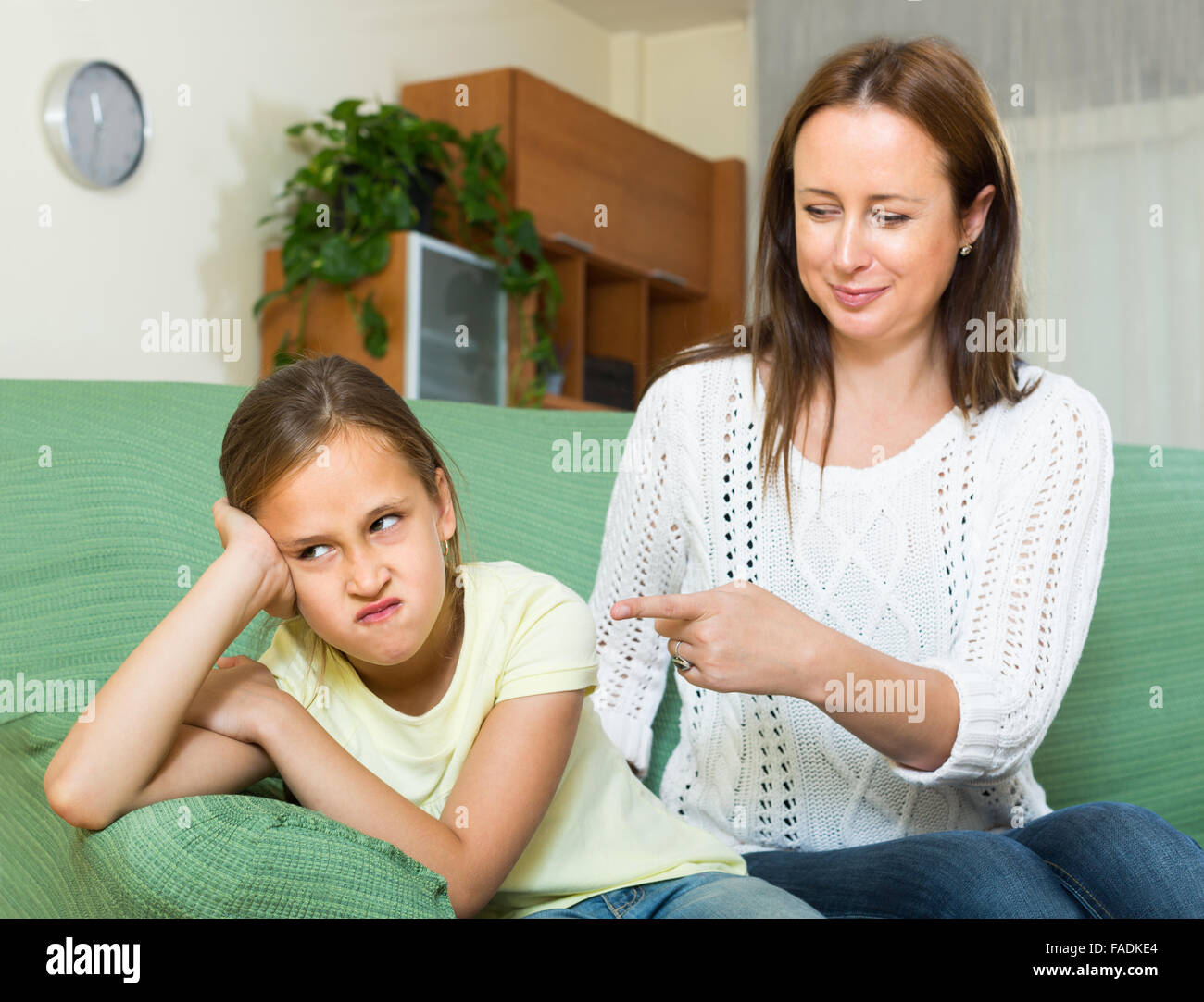 Woman berating offended daughter in home interior Stock Photo - Alamy