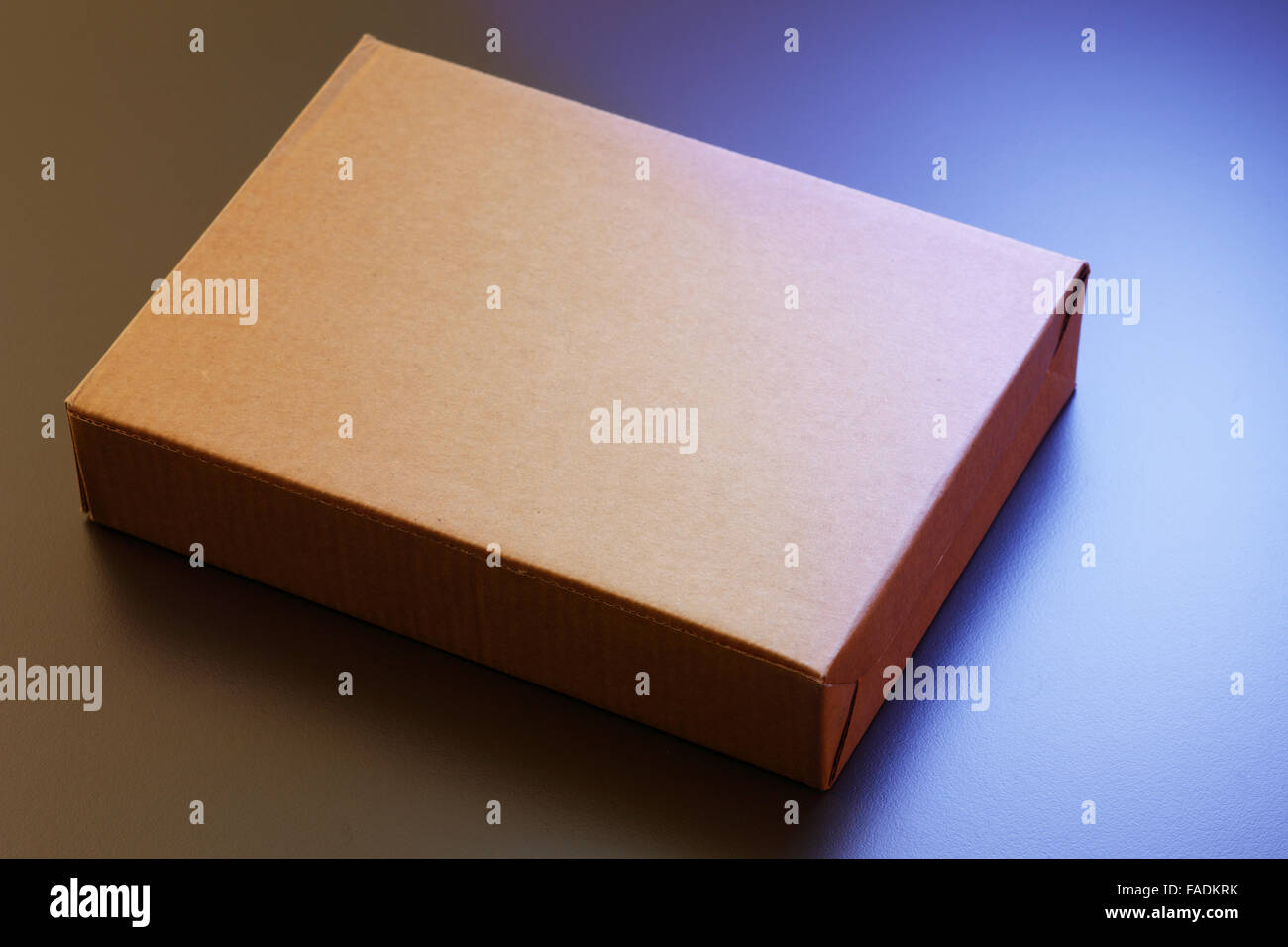 blank cardbox on the orange and blue background Stock Photo - Alamy
