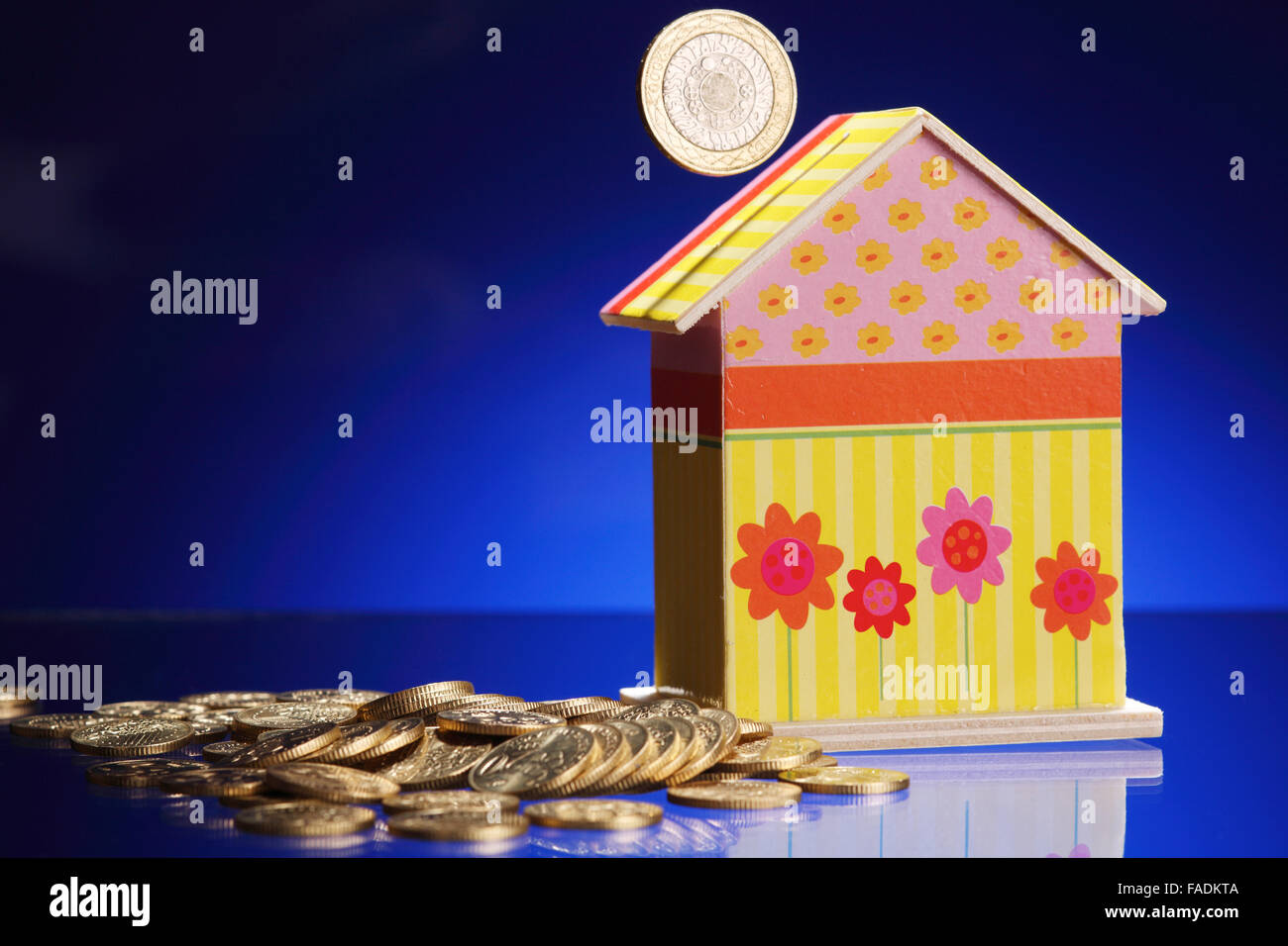 coin bank in the shape of a house Stock Photo - Alamy