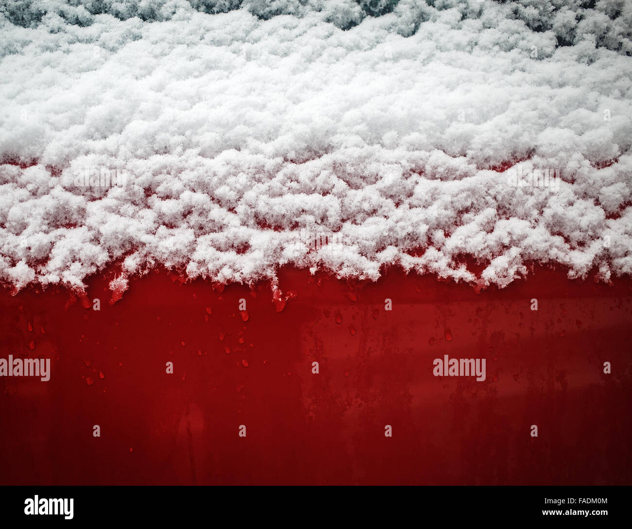 Fluffy snow flakes on the red metal background Stock Photo - Alamy