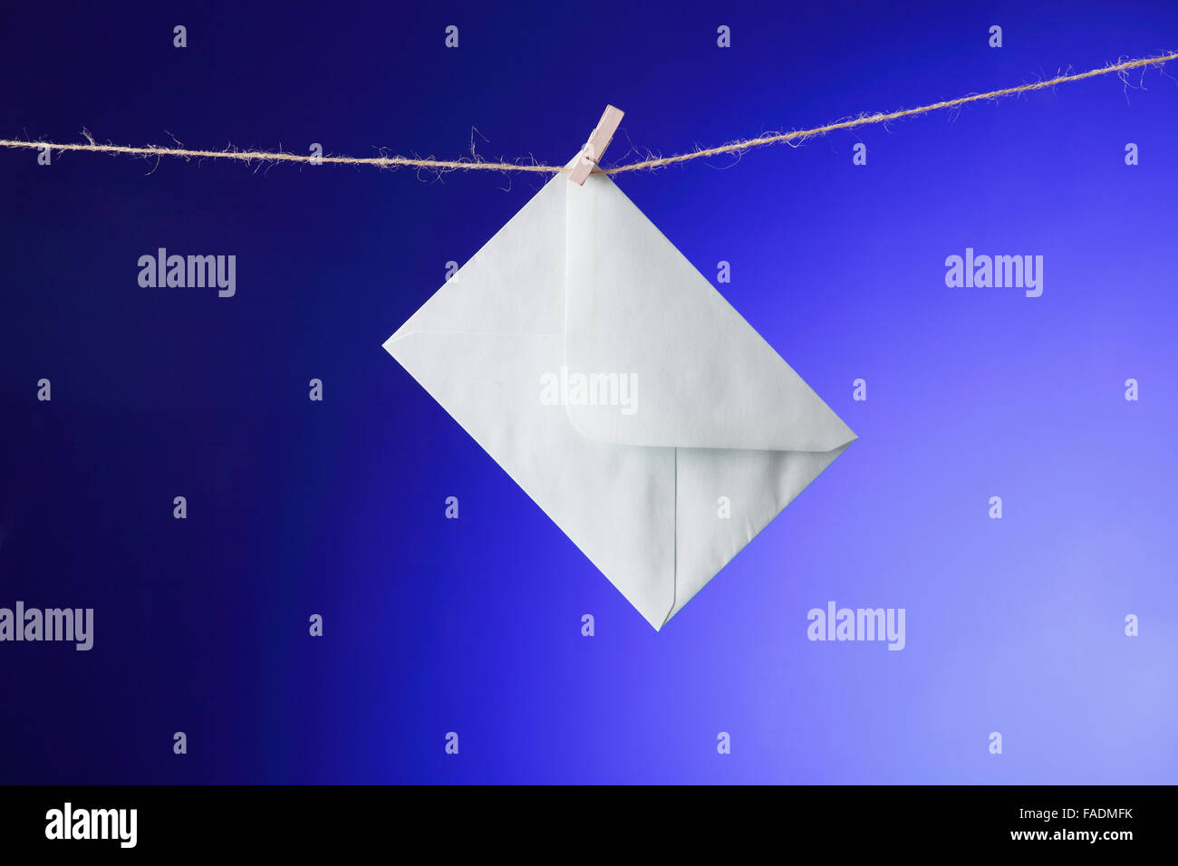 White Envelope on clothes line Stock Photo - Alamy