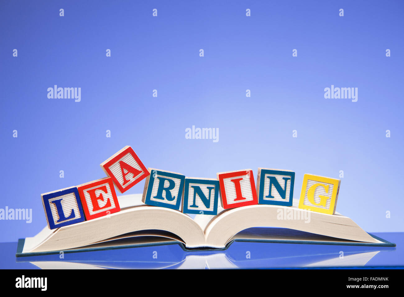 The word 'Learning' stacked by alphabet block Stock Photo - Alamy