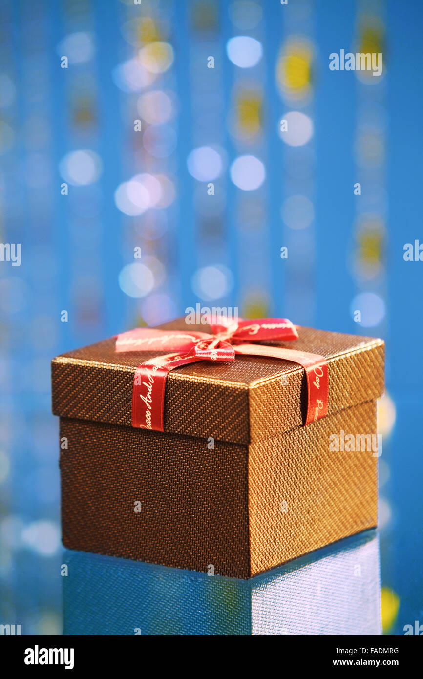 Gift wrapped by red ribbon hi-res stock photography and images - Alamy
