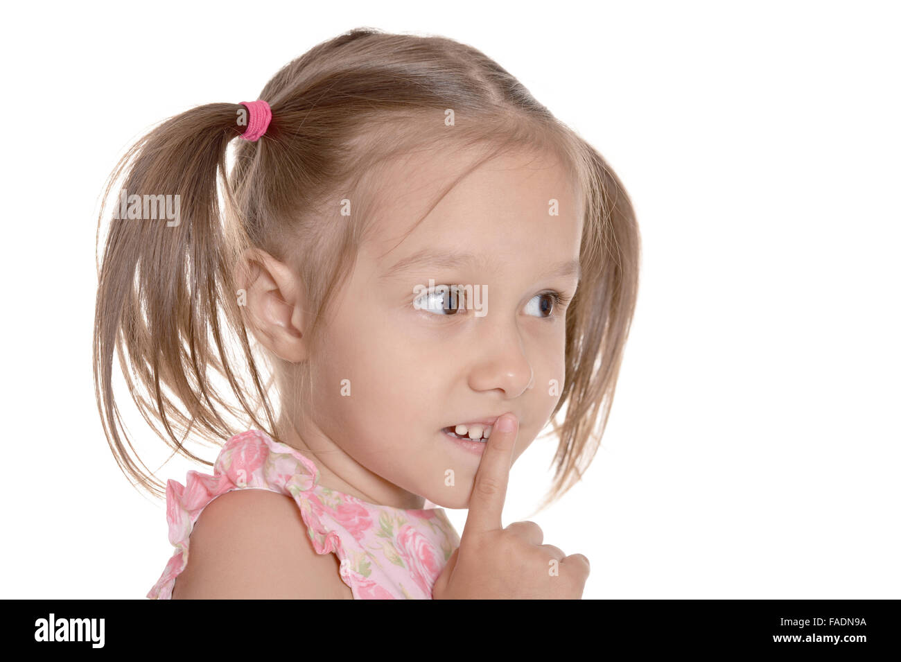 Little girl showing hush sign Stock Photo - Alamy